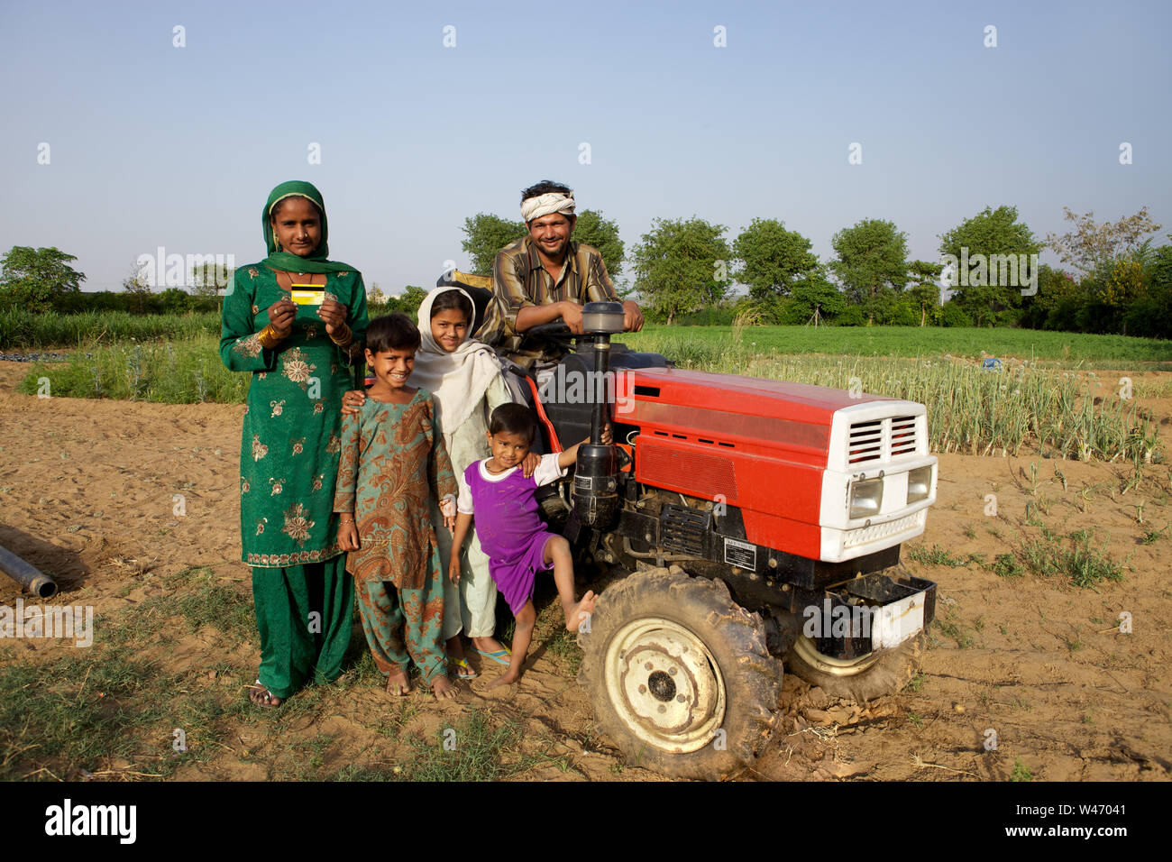 Rural family standing in a field Stock Photo - Alamy