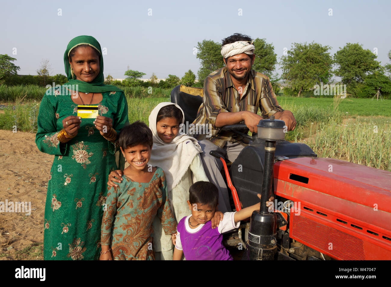 Rural family standing in a field Stock Photo - Alamy