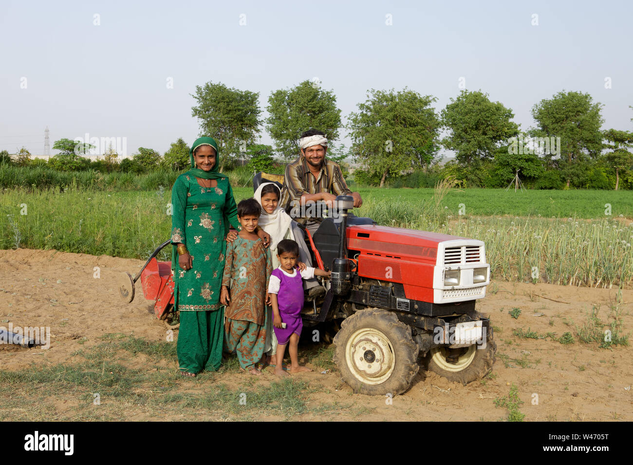 Rural family standing in a field Stock Photo - Alamy