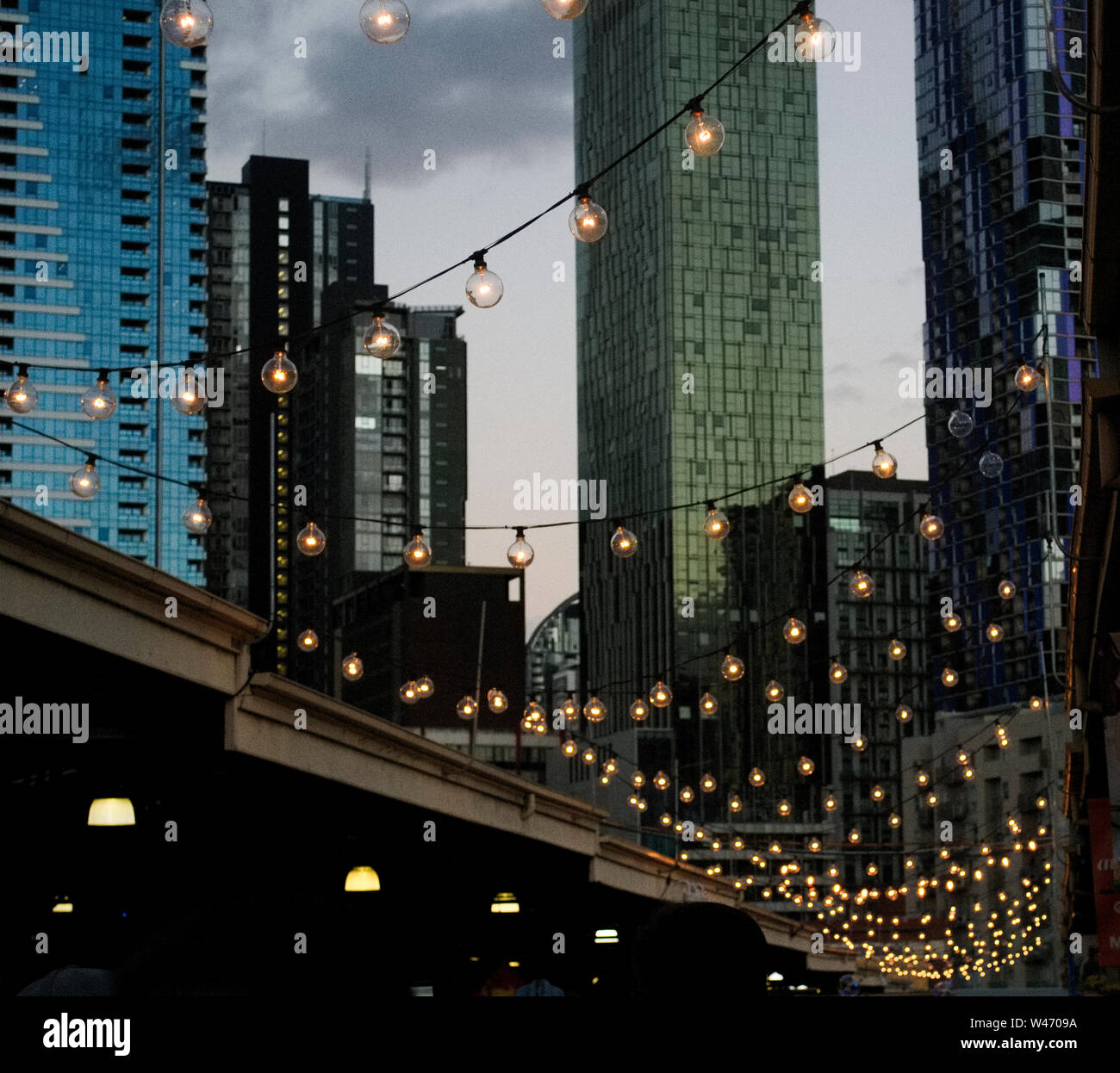 A hanging string of lights at Queen Victoria Night Market with the ...