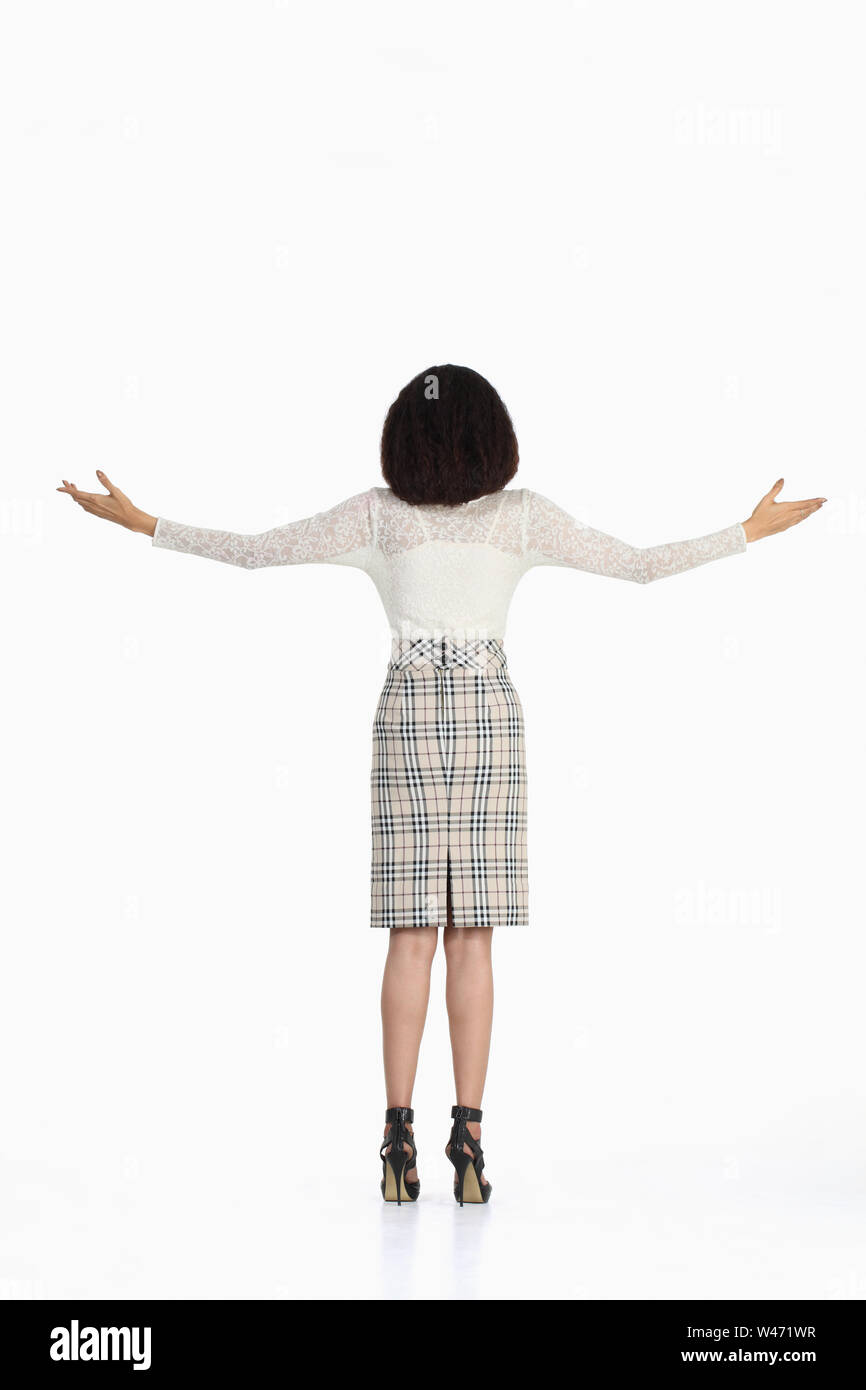 Woman arms raised rear view Cut Out Stock Images & Pictures - Alamy
