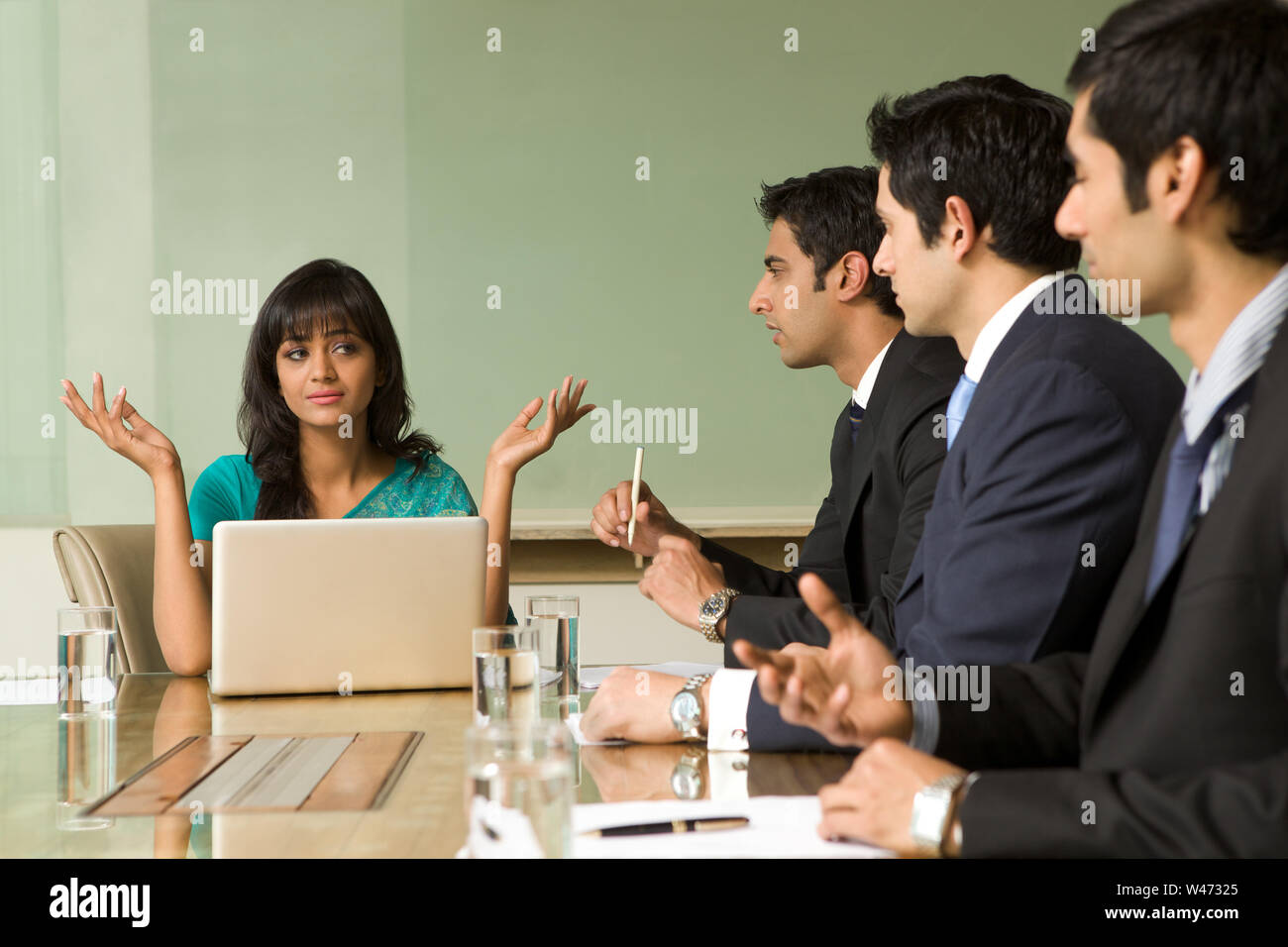 Business executives in an office meeting Stock Photo - Alamy