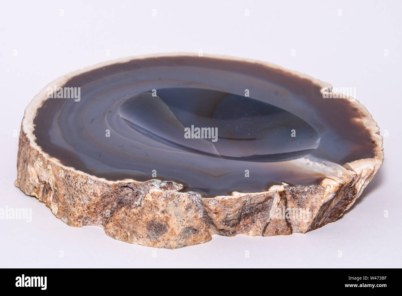 Slice of Geode blue colorful gemstone looking like normal rock from ...