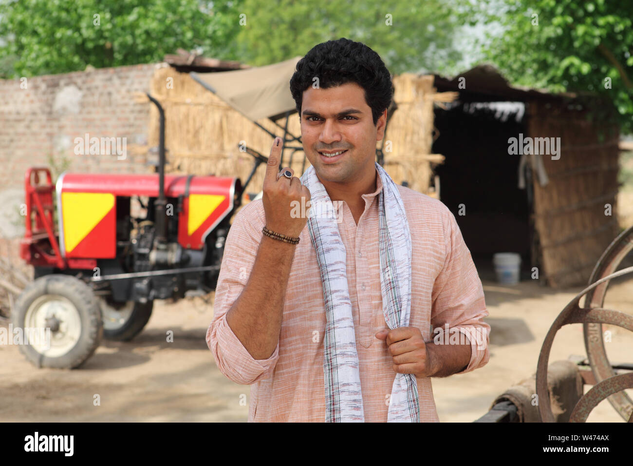 Portrait of a farmer pointing upward Stock Photo - Alamy