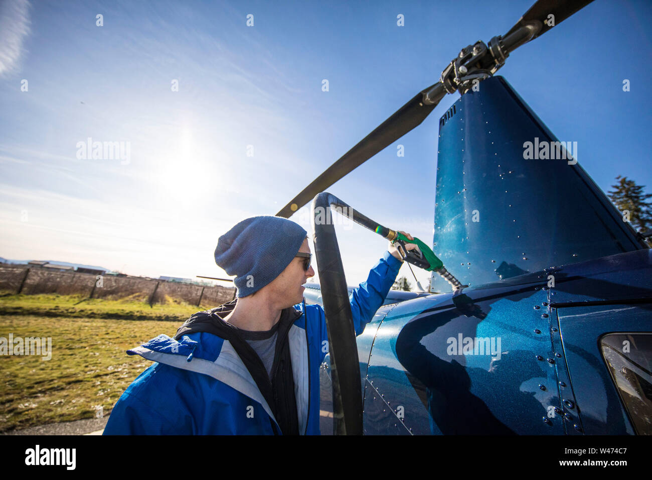Man standing on helicopter hi-res stock photography and images - Alamy