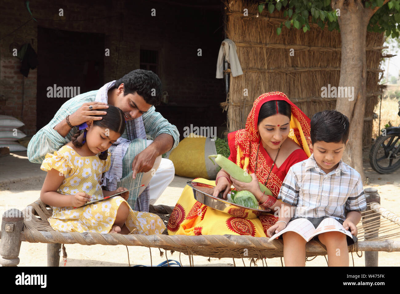 Parents teaching their children Stock Photo - Alamy Parents teaching their children Stock Photo - Alamy