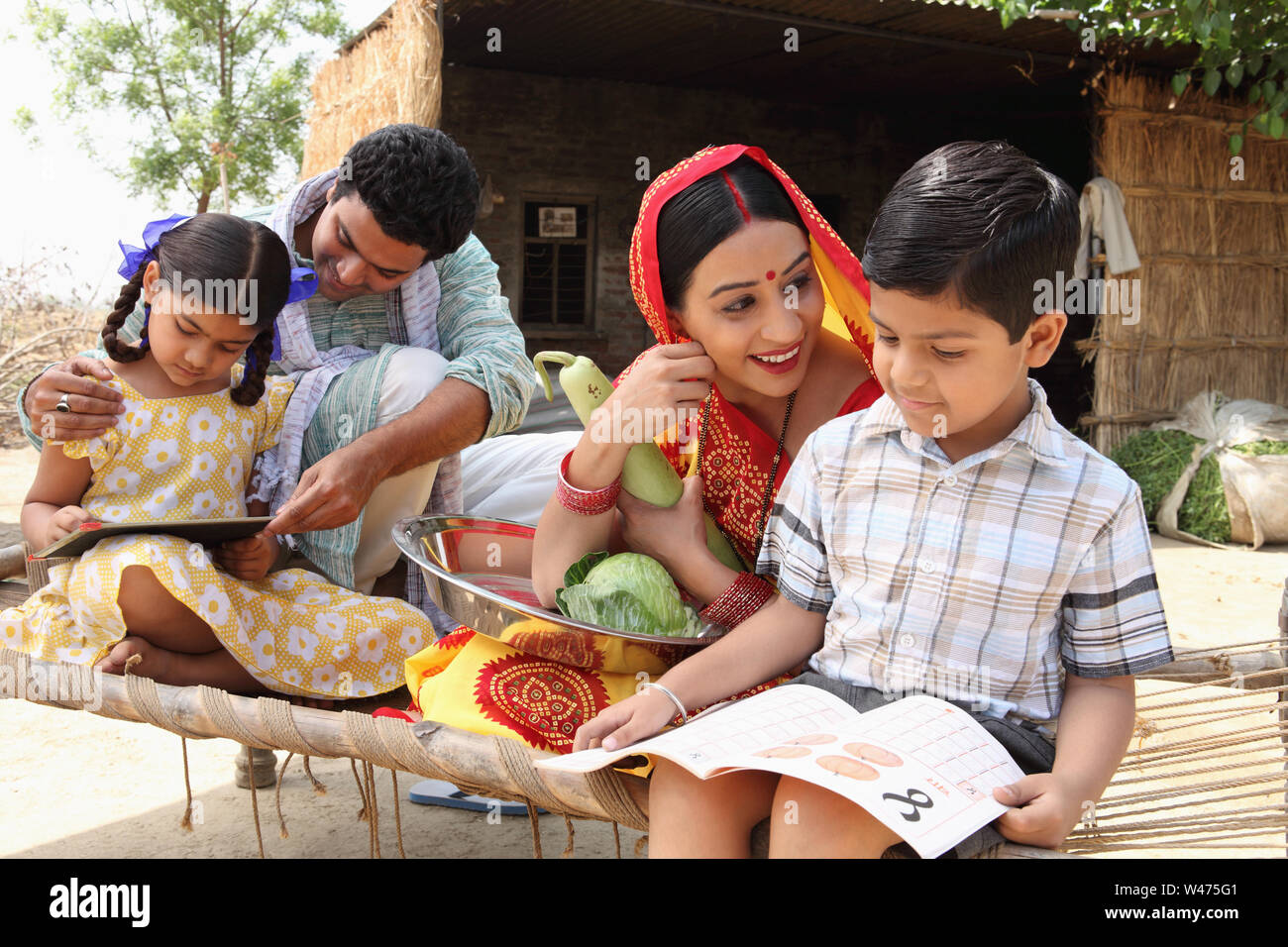 Parents teaching their children Stock Photo - Alamy