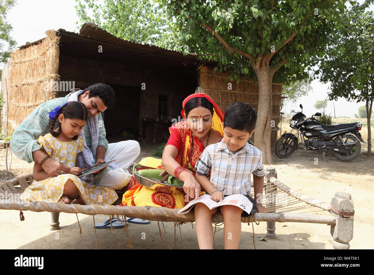Parents teaching their children Stock Photo - Alamy