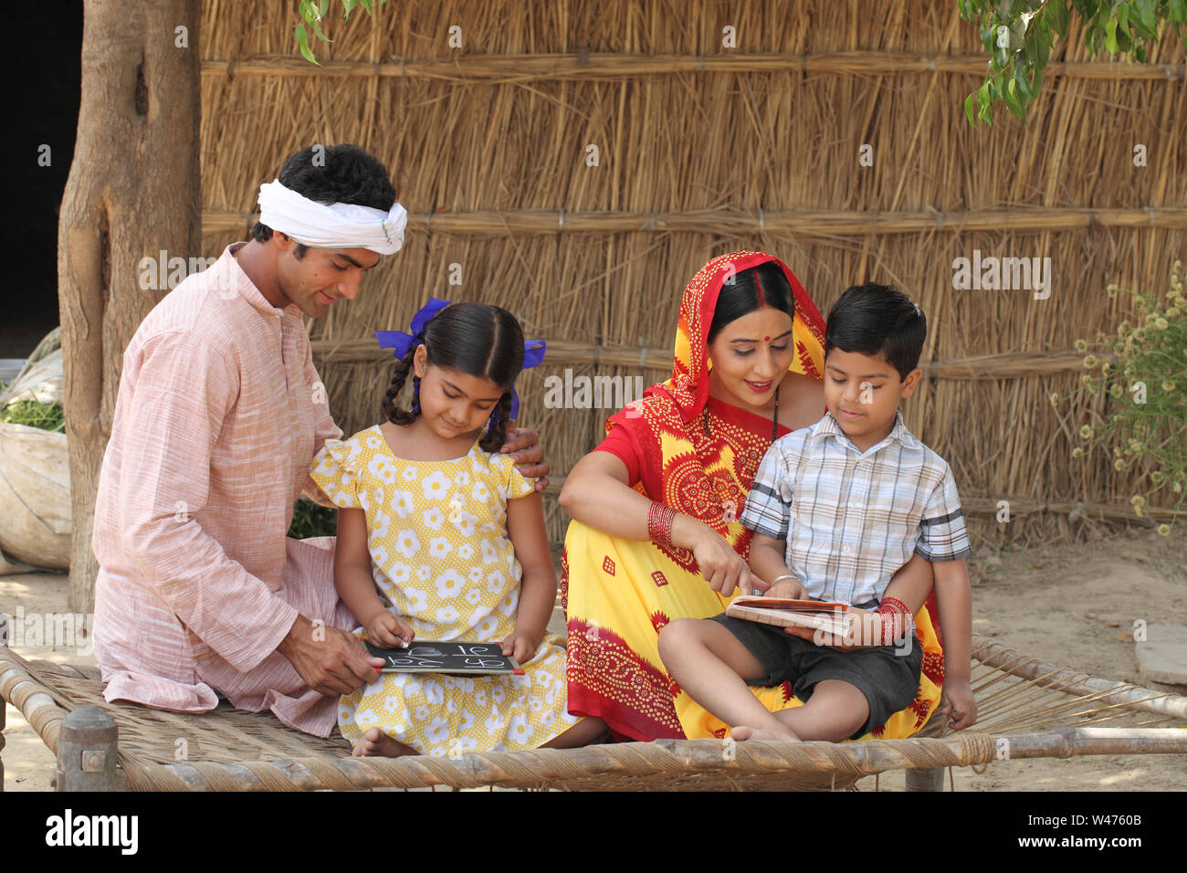 Indian parents teaching children hi-res stock photography and images ... Indian parents teaching children hi-res stock photography and images ...