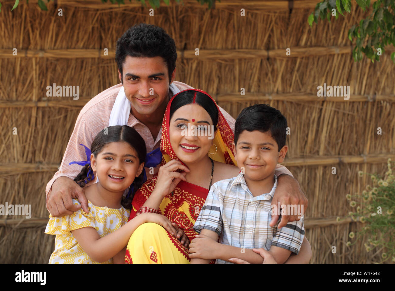 Portrait of Indian rural family smiling Stock Photo - Alamy