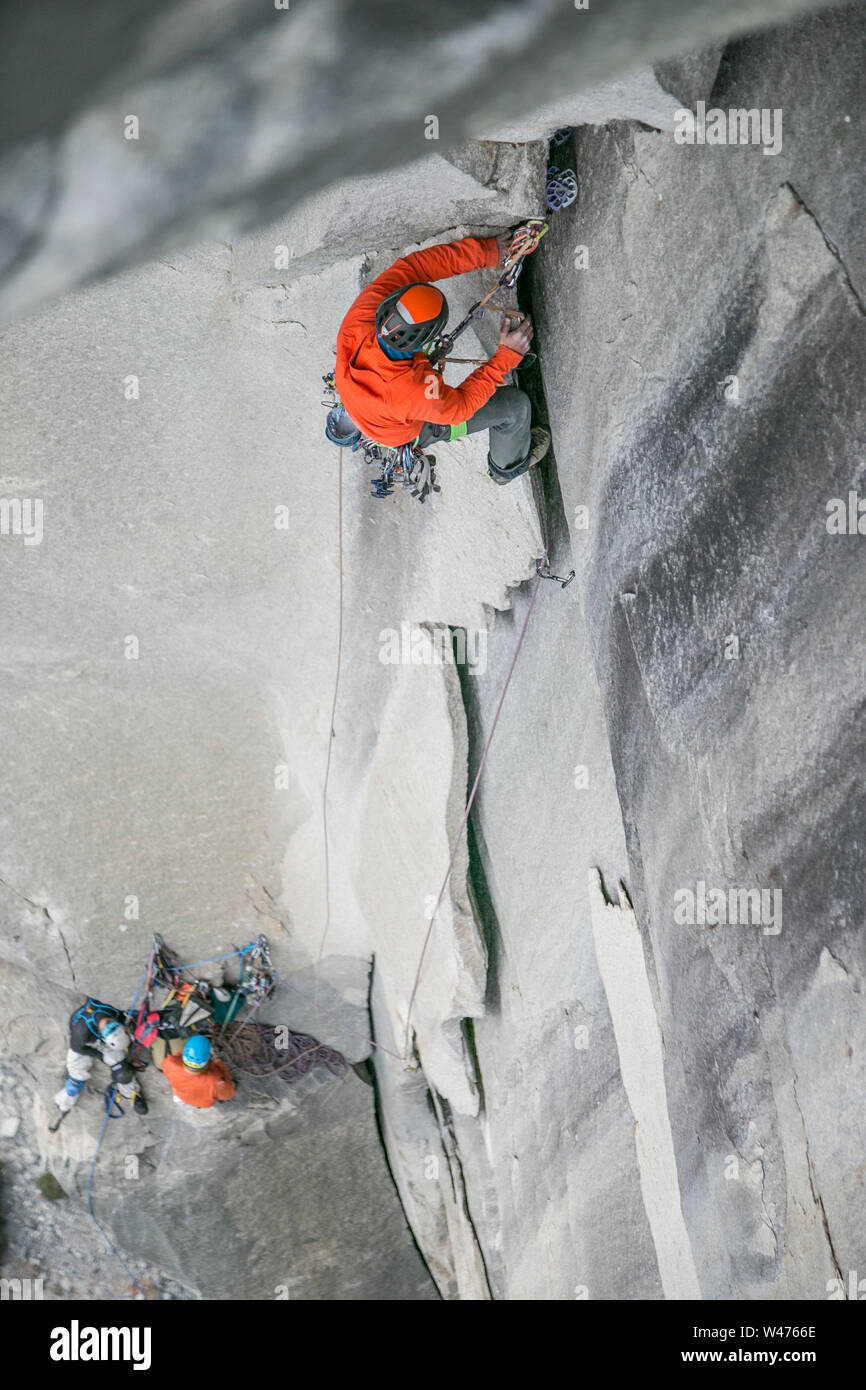 A climber leads an impressive steep and wide pitch high on El Capitan ...