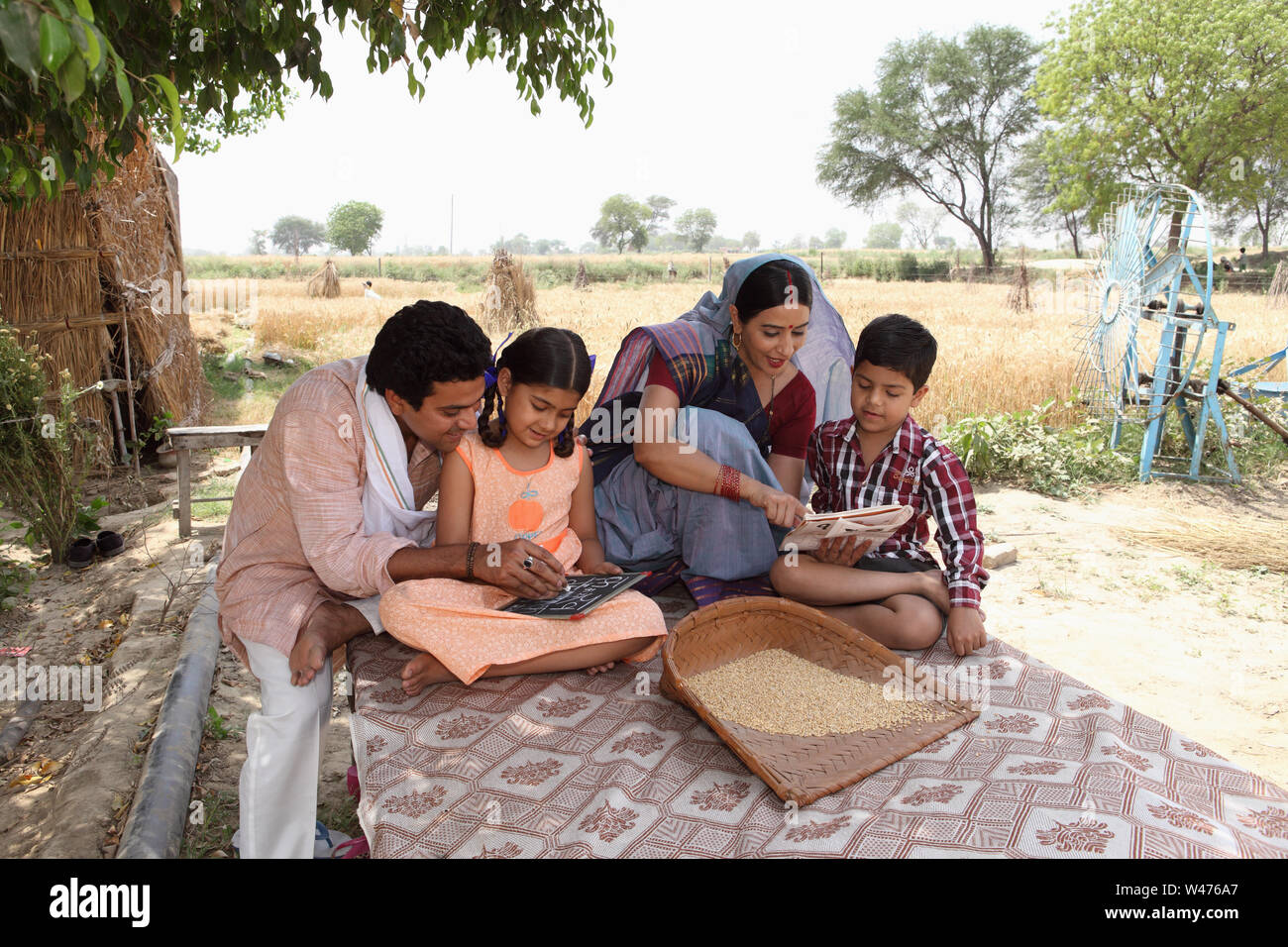 Indian Parents Teaching Children High Resolution Stock Photography and ... Indian Parents Teaching Children High Resolution Stock Photography and ...