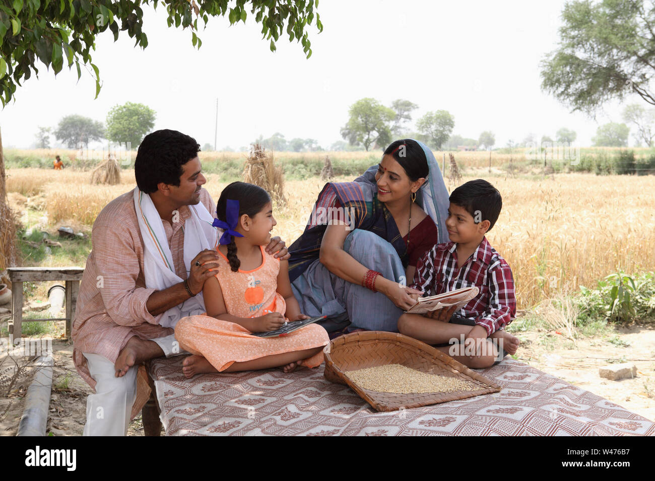 Parents teaching their children Stock Photo - Alamy Parents teaching their children Stock Photo - Alamy