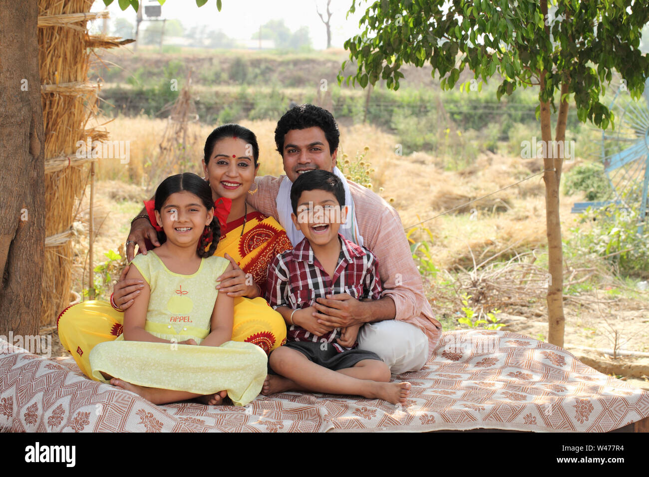 Portrait of a rural family smiling Stock Photo - Alamy