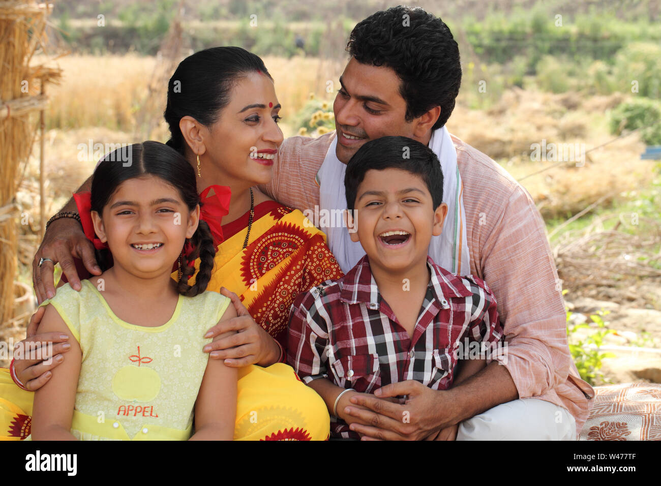 Rural family smiling Stock Photo - Alamy