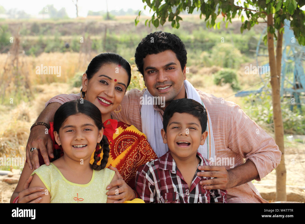 Portrait of a rural family smiling Stock Photo - Alamy