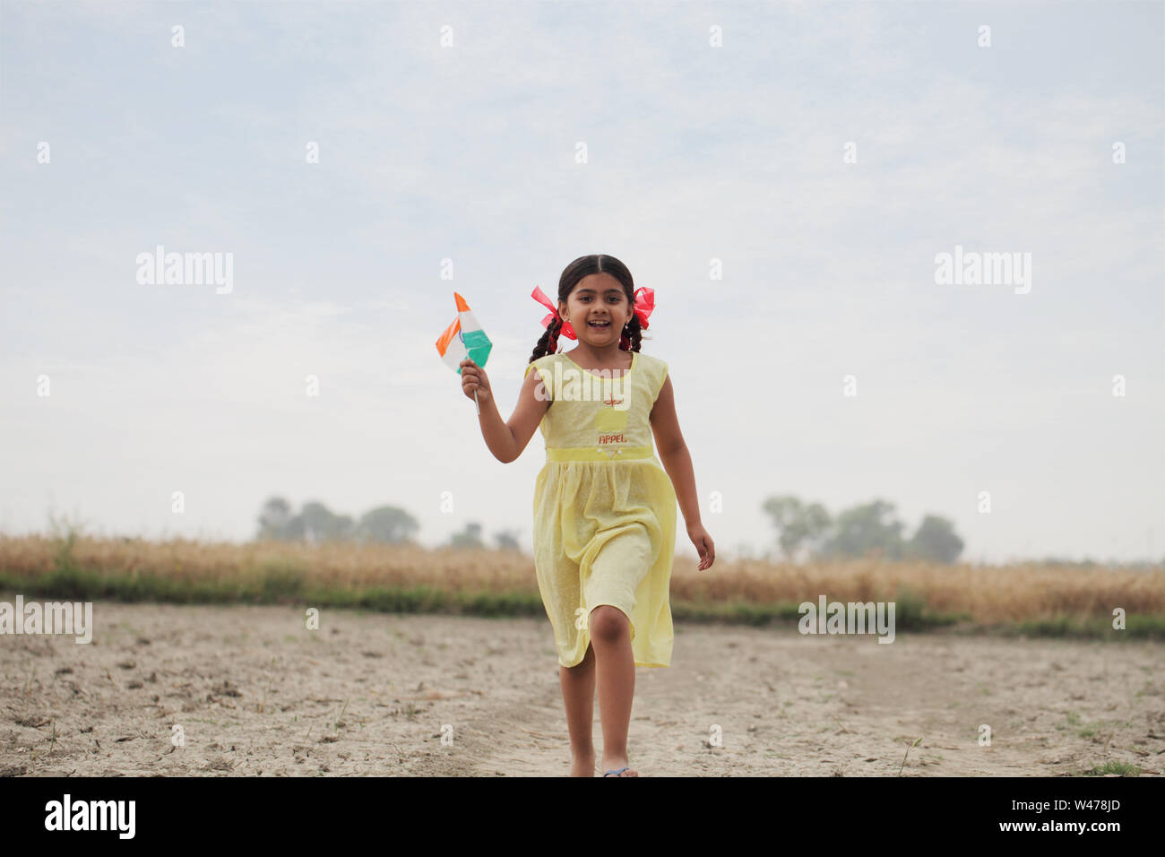Indian girl running in field hi-res stock photography and images - Alamy