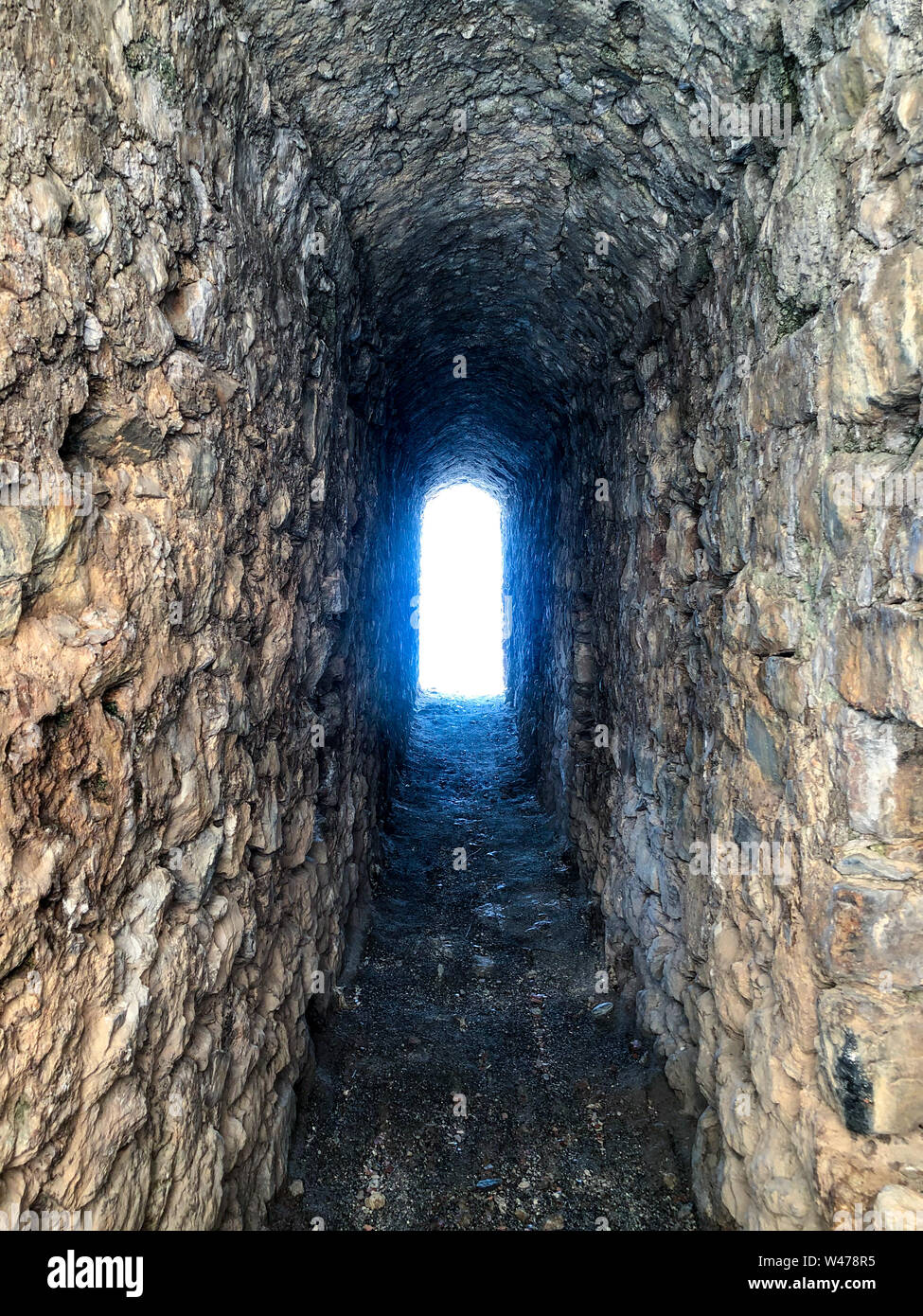 Tunnel arched hole in the stone wall of the fortress Stock Photo - Alamy
