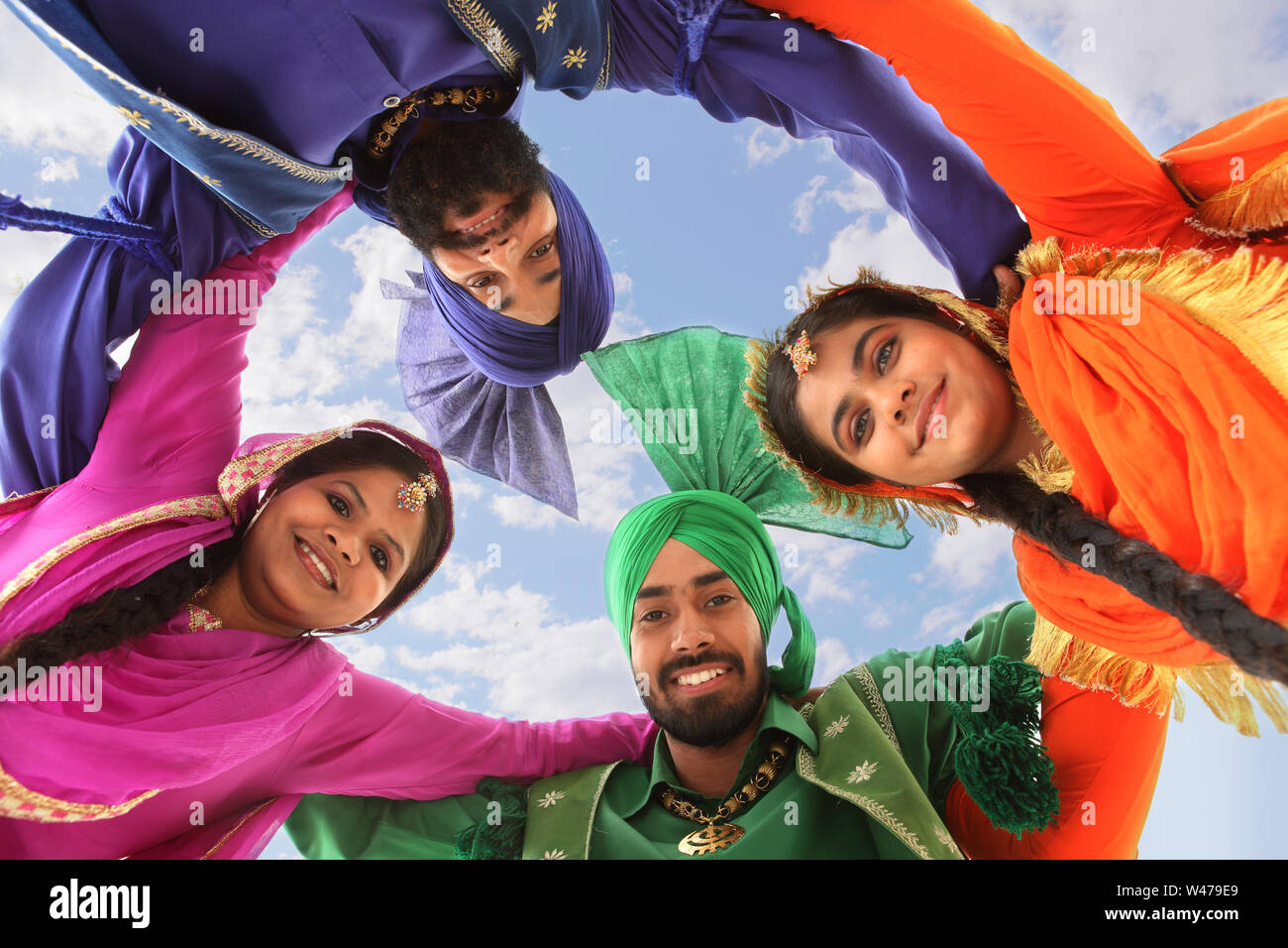 Group of people performing folk dance Stock Photo - Alamy