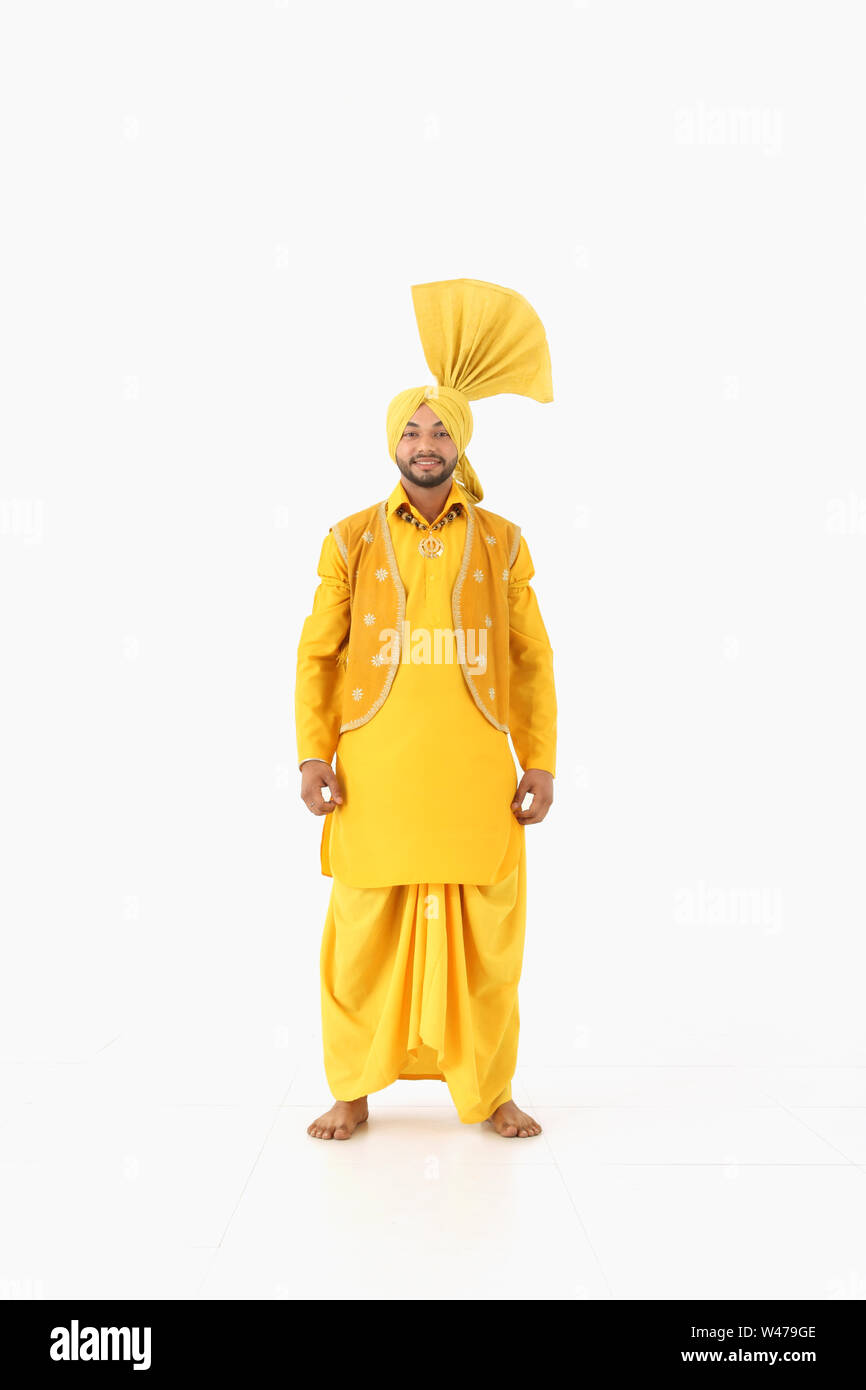 Man standing and smiling Stock Photo - Alamy