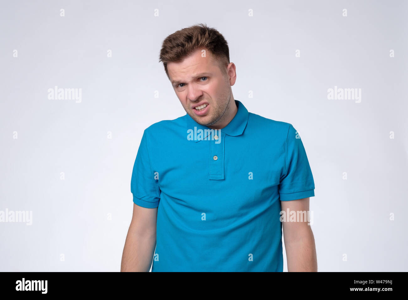 Angry young man in blue hi-res stock photography and images - Alamy