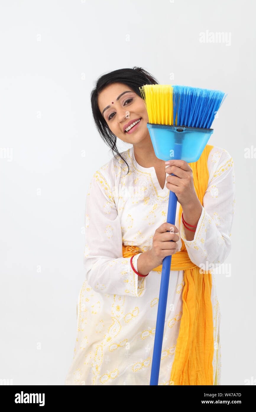 Mature housewife broom hi-res stock photography and images - Alamy