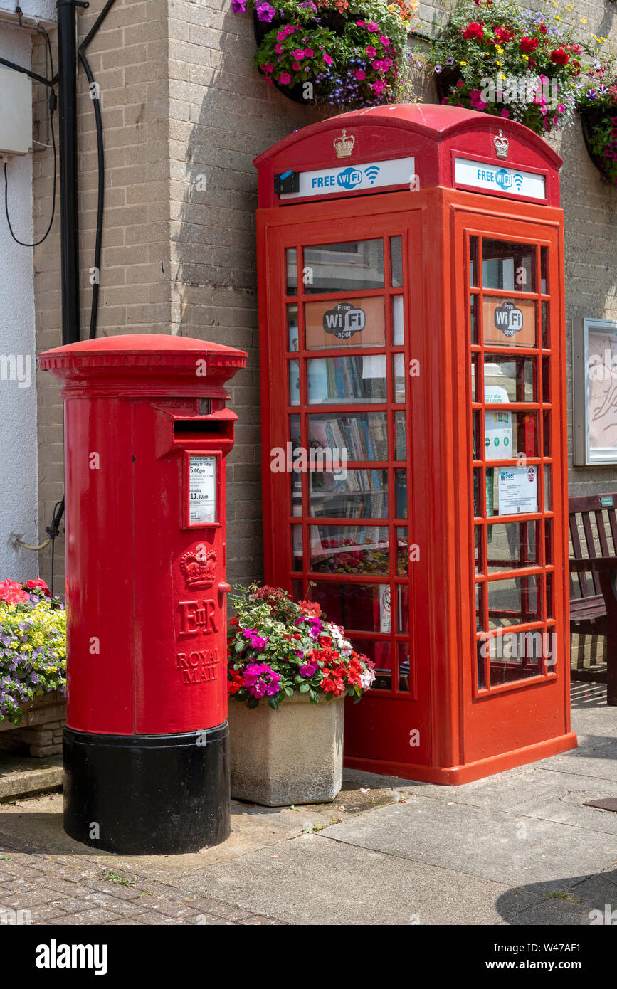 Beer, Devon, England, UK. July 2019. A Royal Mail postbox and a former ...