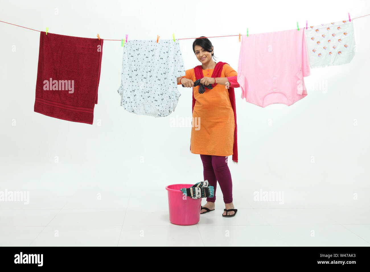 Wringing clothes hi-res stock photography and images - Alamy