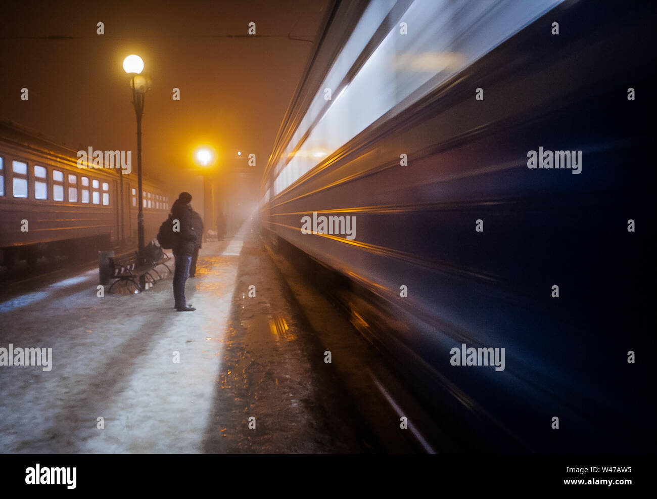 Moving Train Past Station Stock Photo - Alamy
