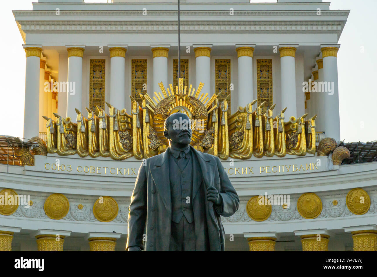 Soviet communist leader Vladimir Lenin statue in front of old building ...