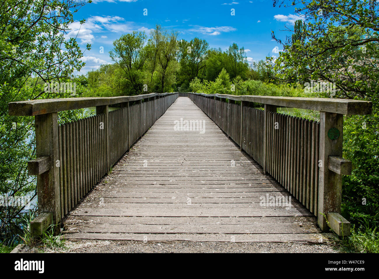 Beautiful wooden bridge goes into the distance Stock Photo - Alamy