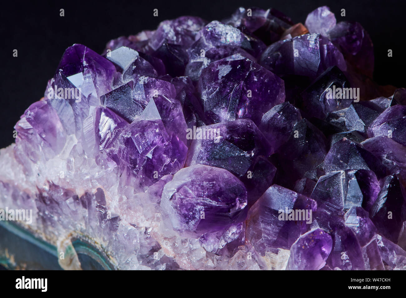 macro of Amethyst gemstone against black background Stock Photo - Alamy