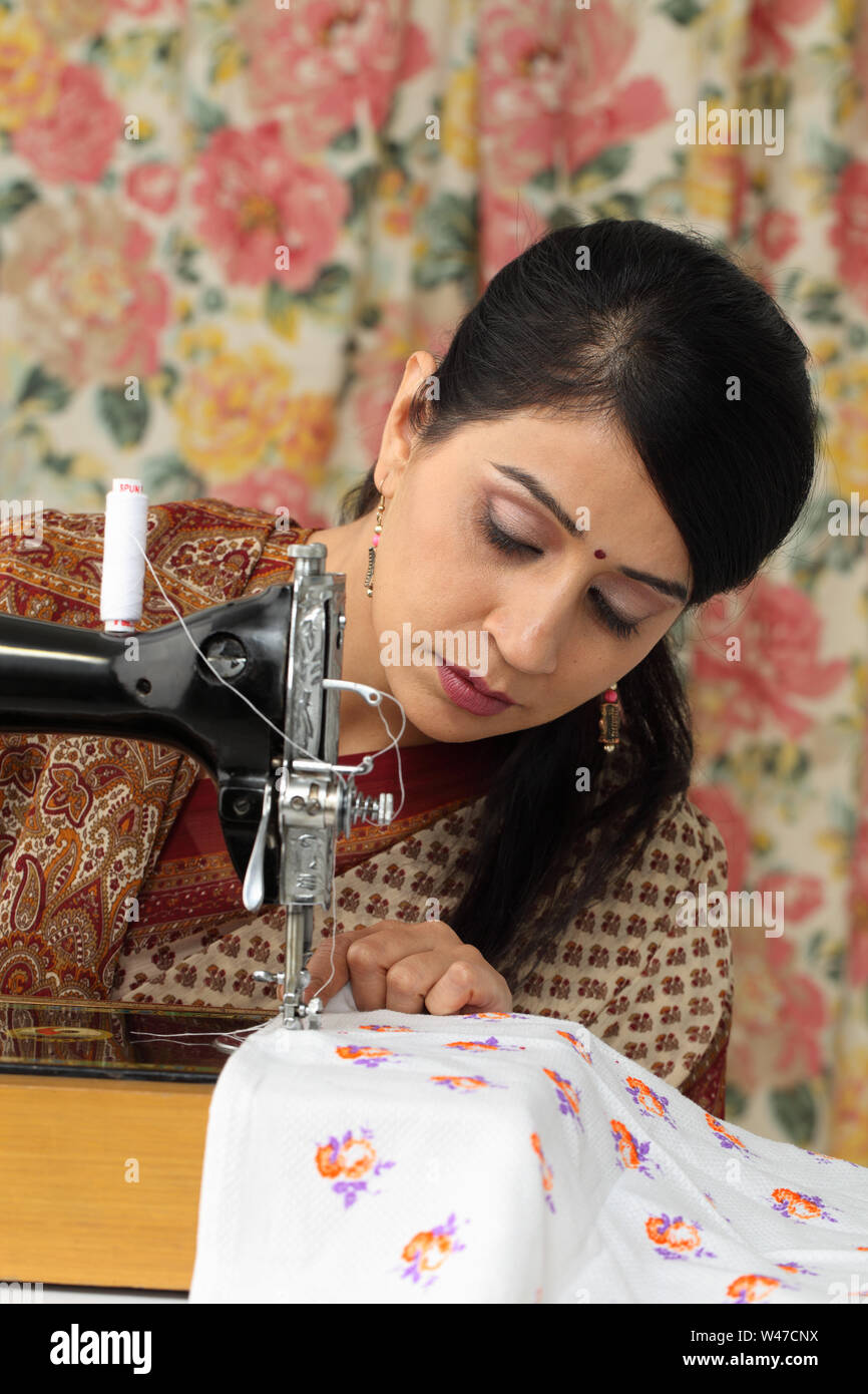 Indian dressmaker using sewing machine hi-res stock photography and ...