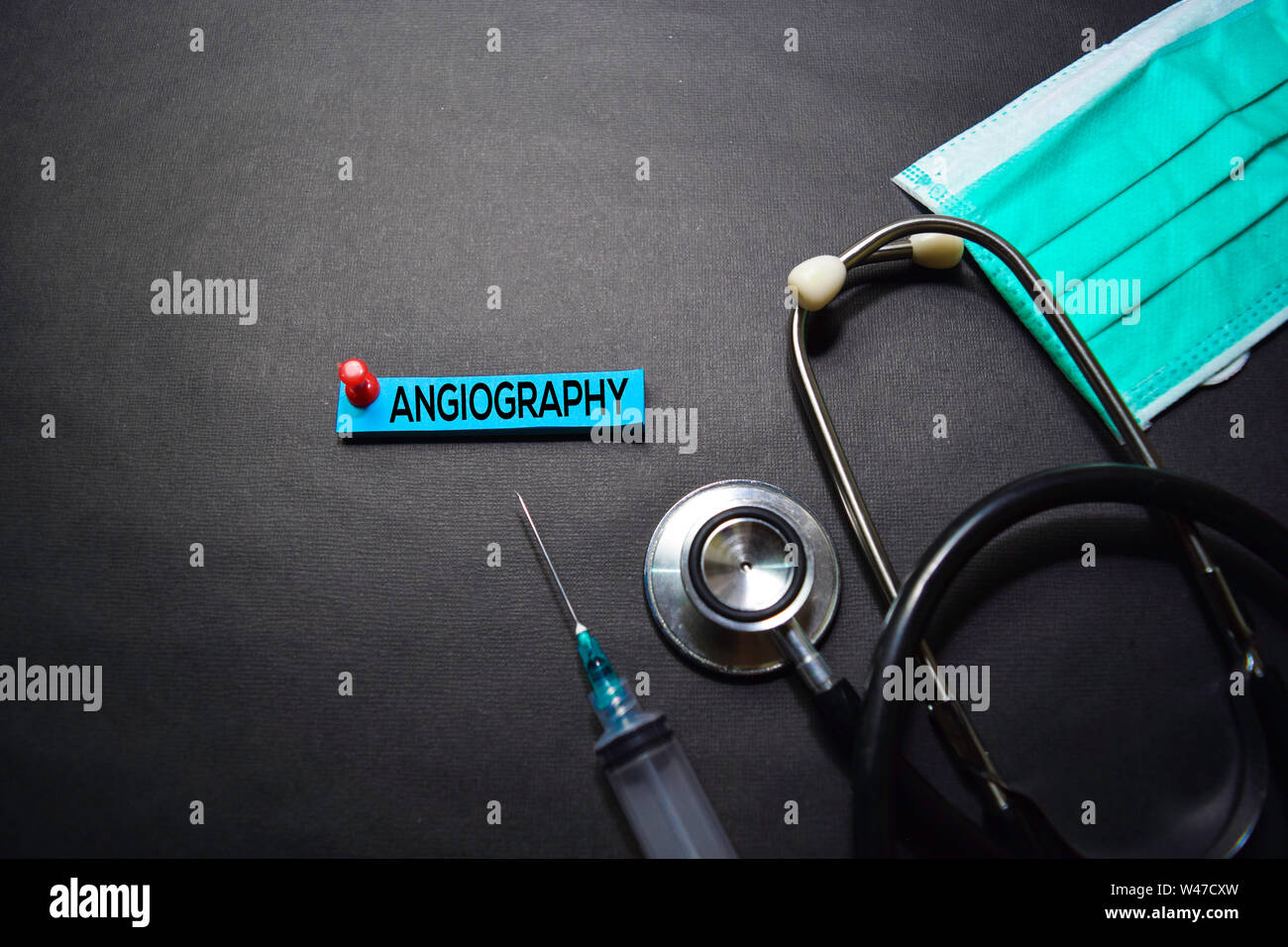 Angiography text on Sticky Notes. Top view isolated on black background ...