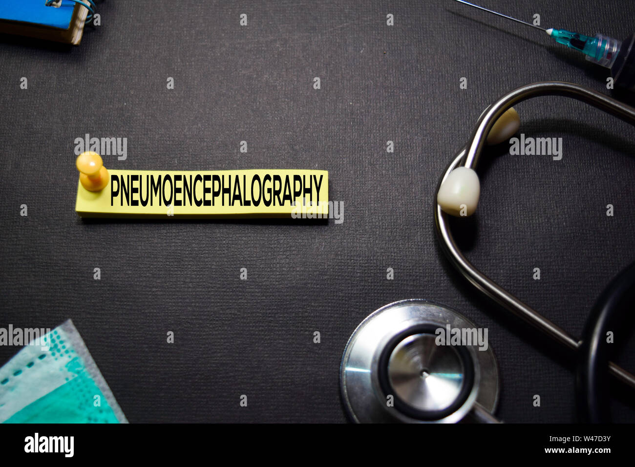 Pneumoencephalography text on Sticky Notes. Top view isolated on black ...