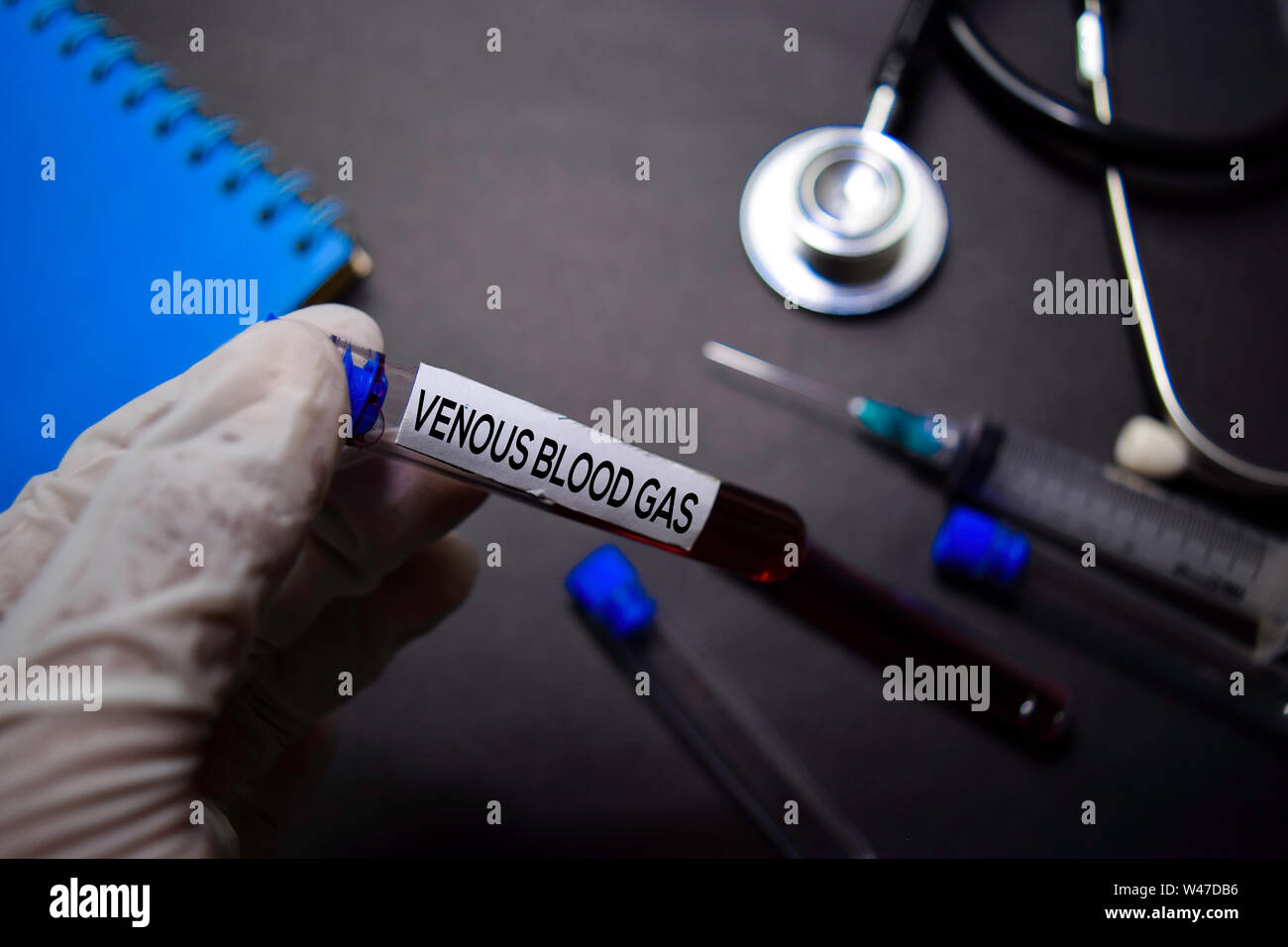 Venous Blood Gas text on Sticky Notes. Top view isolated on black ...