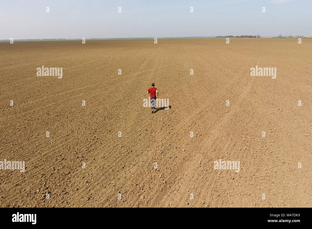 Athlete running across field looking hi-res stock photography and ...