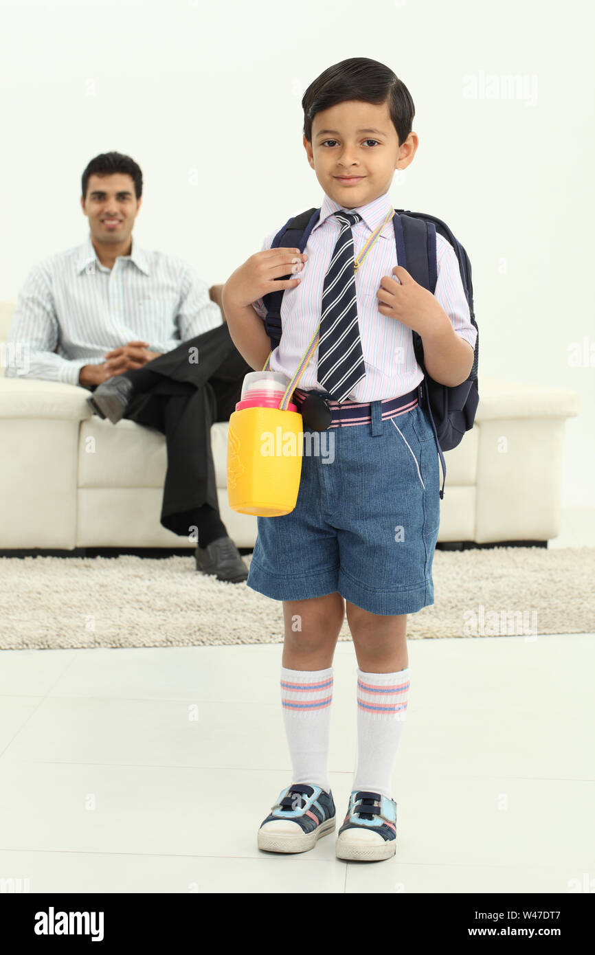 Boy carrying schoolbag hi-res stock photography and images - Alamy
