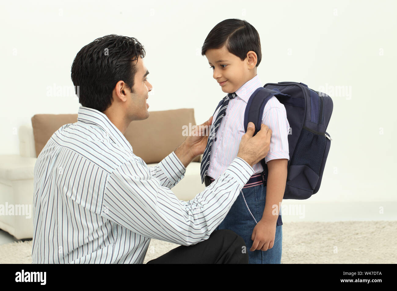Man preparing his son for school Stock Photo - Alamy