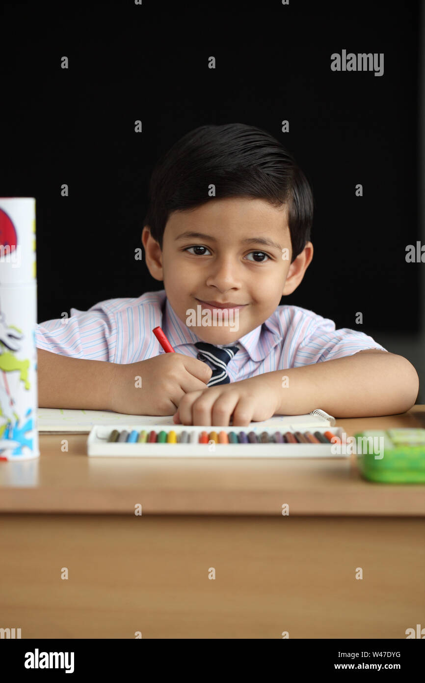 Boy coloring crayons drawing hi-res stock photography and images - Alamy