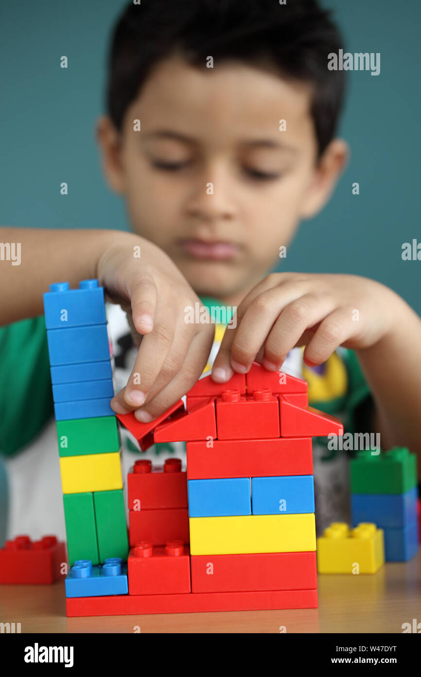 Boy playing with blocks Stock Photo - Alamy