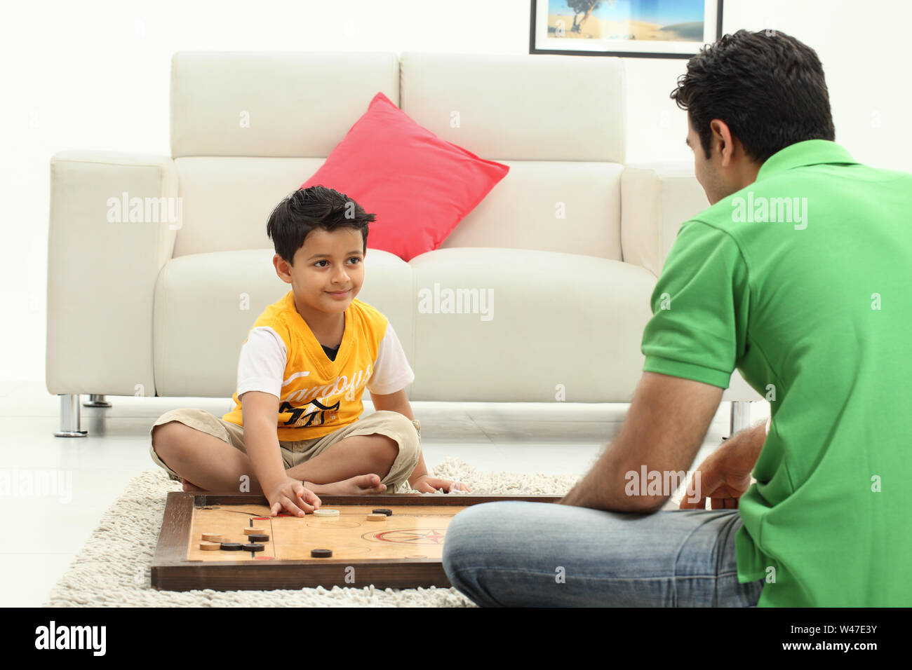 Carrom board man playing game hi-res stock photography and images - Alamy