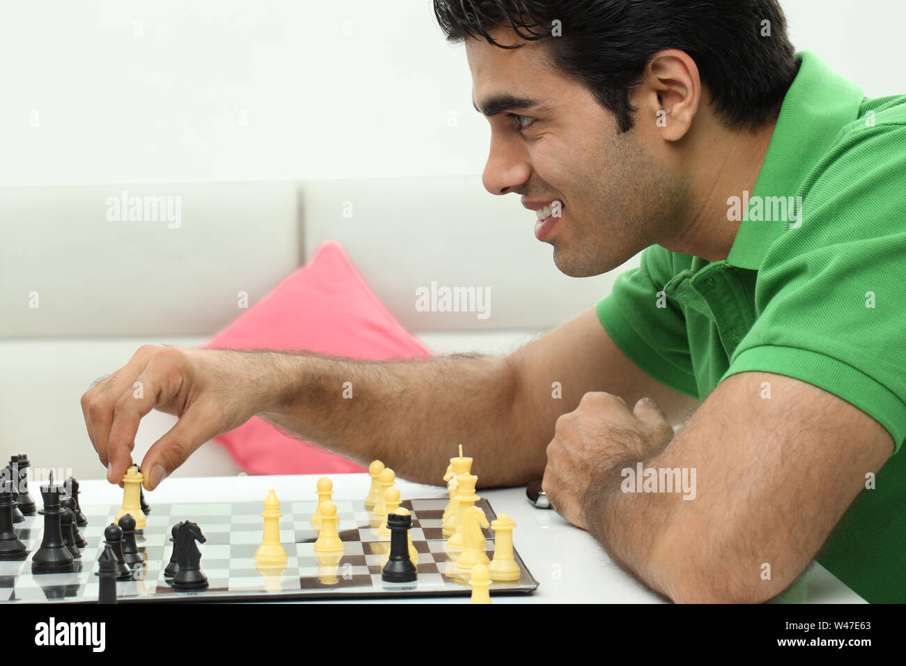 Man playing chess at home Stock Photo - Alamy