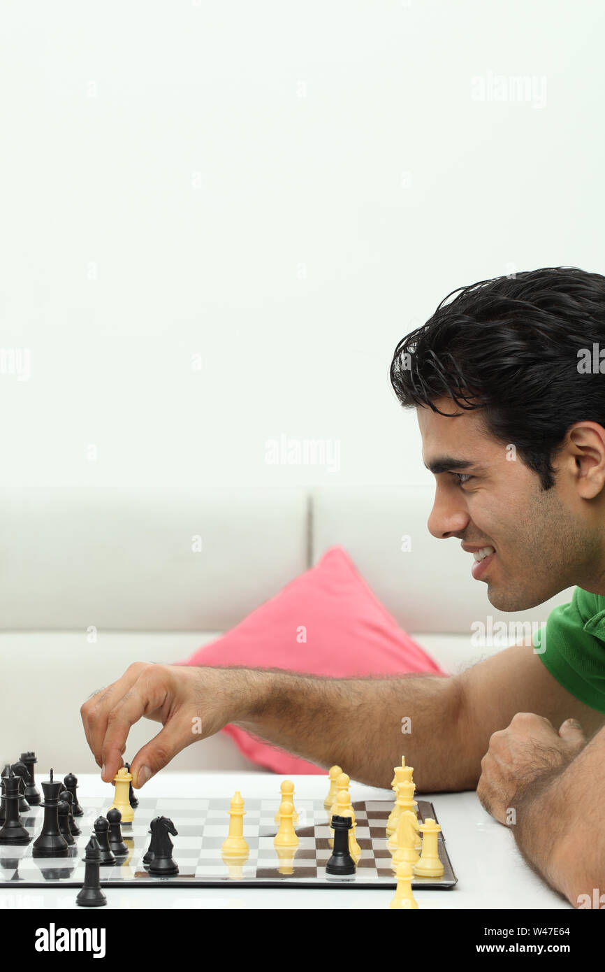 Man playing chess at home Stock Photo - Alamy