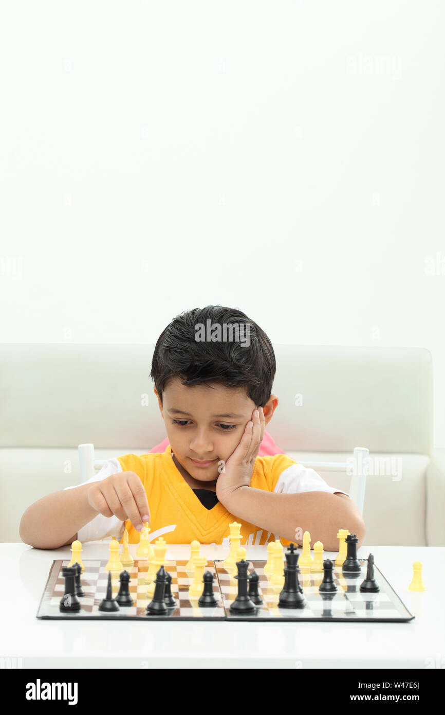 Boy playing chess Stock Photo - Alamy
