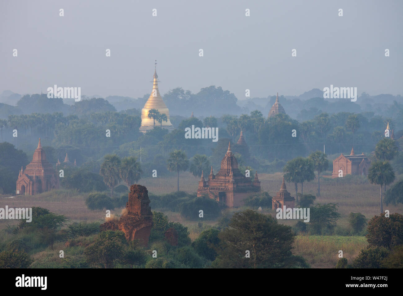 Orange sunrise landscape view with silhouettes of old ancient temples ...