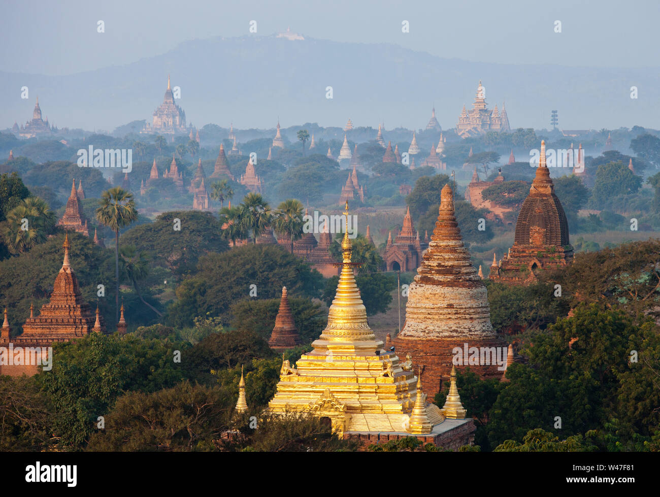 Orange sunrise landscape view with silhouettes of old ancient temples ...