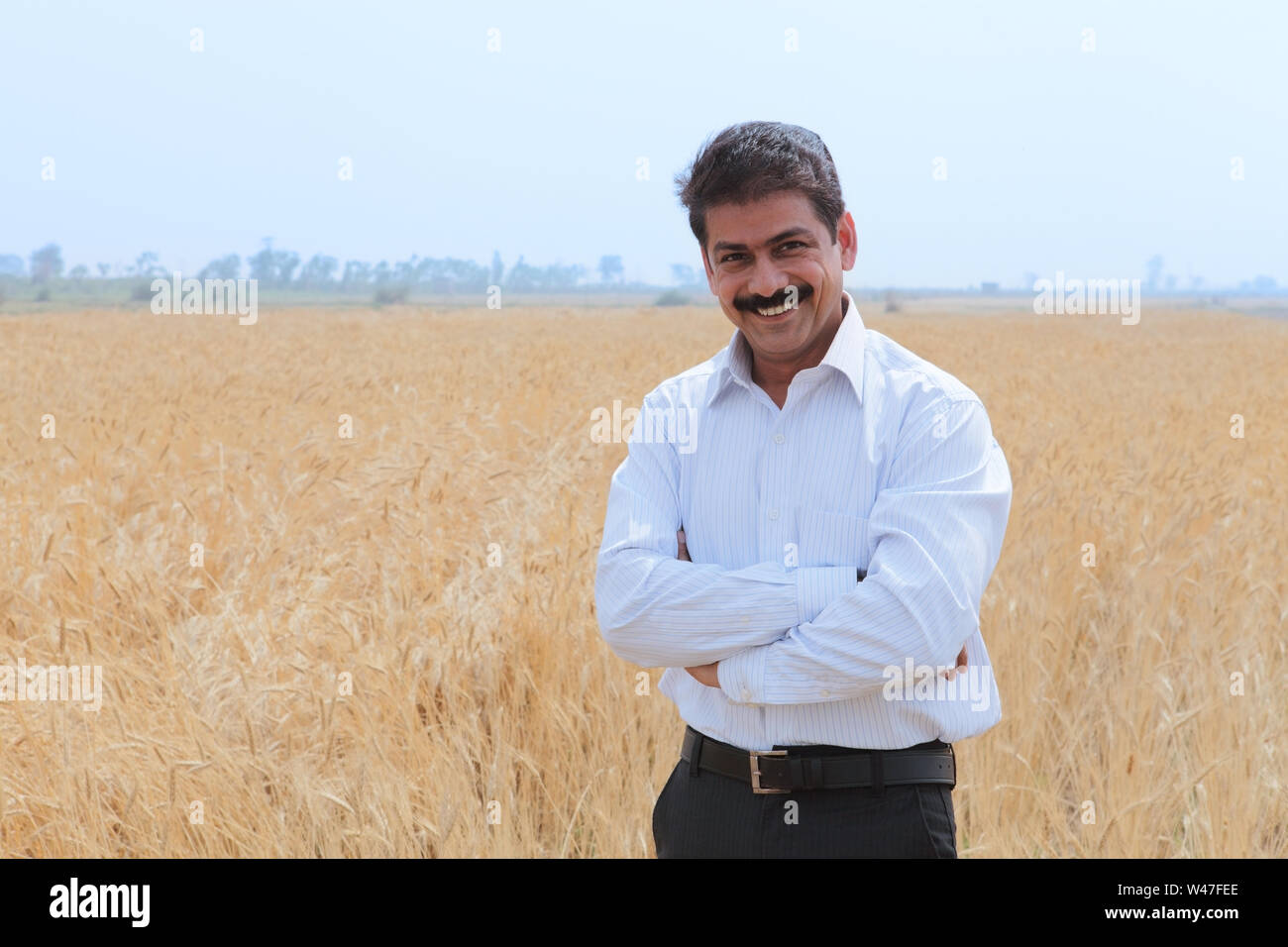 Rural indian man in office hi-res stock photography and images - Alamy