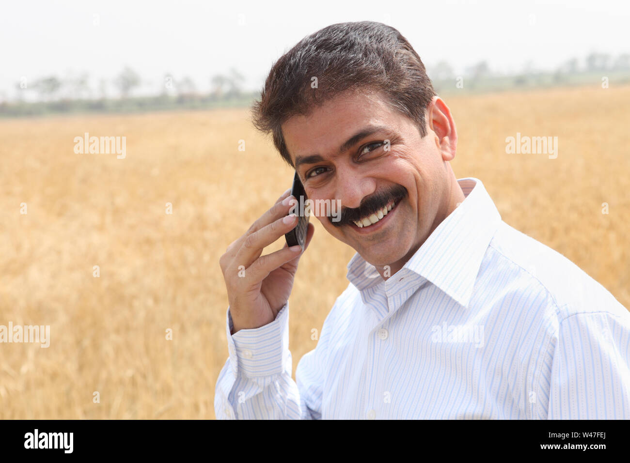 Rural indian man in office hi-res stock photography and images - Alamy