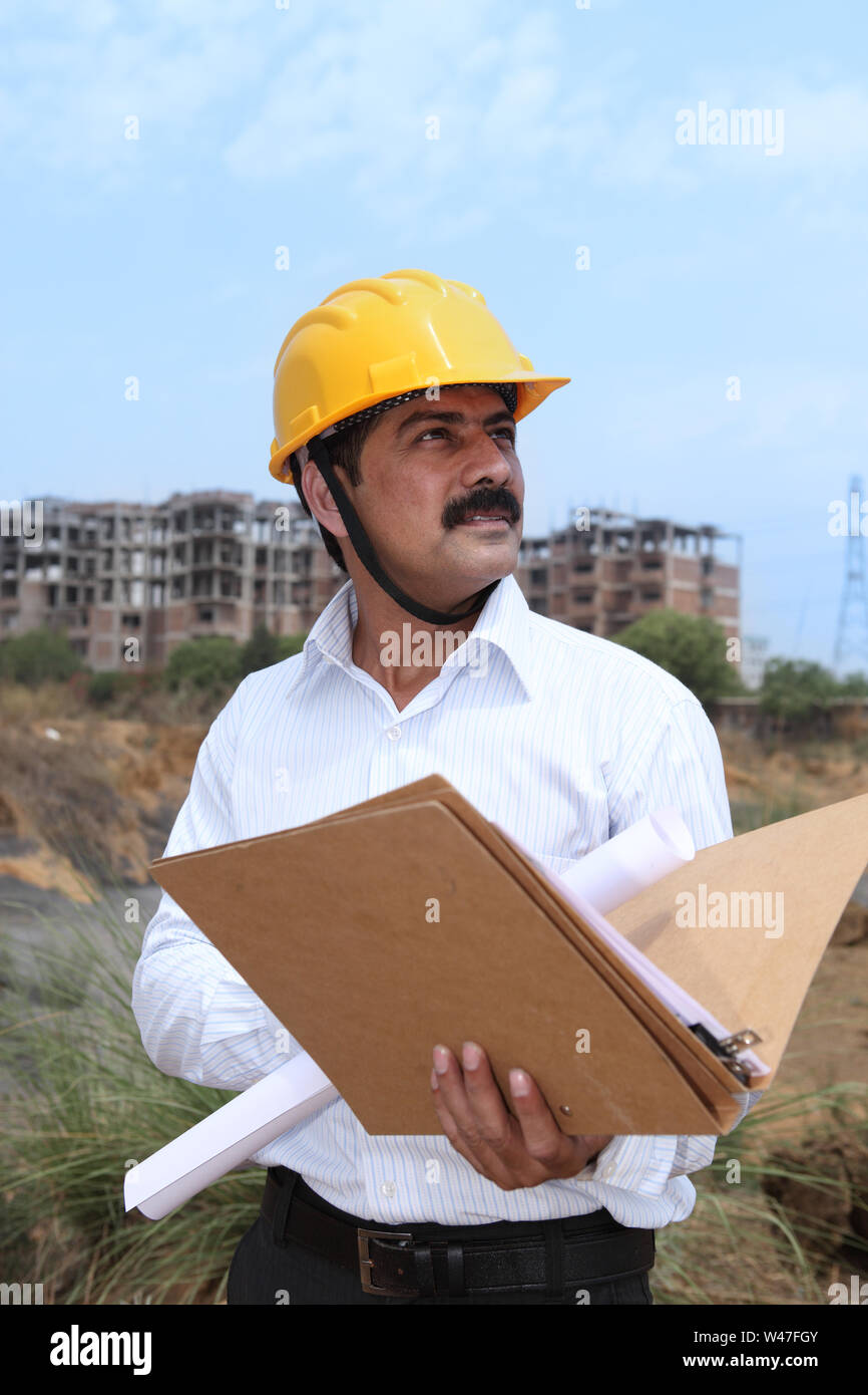 Architect doing paperwork Stock Photo - Alamy
